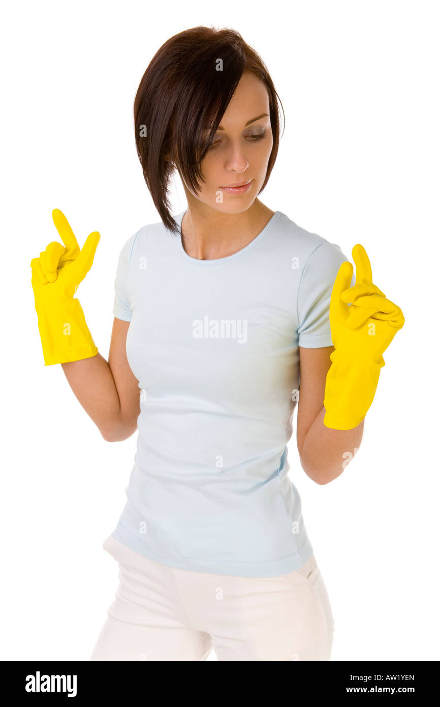 Young woman in yellow rubber gloves with raised hands White background ...
