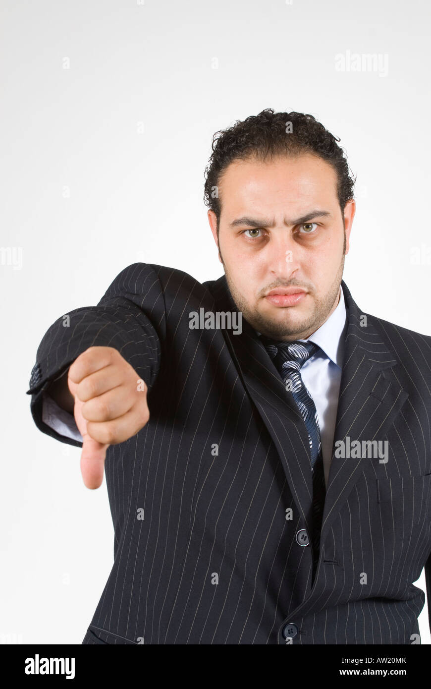 Angry business man thumbs down Stock Photo - Alamy