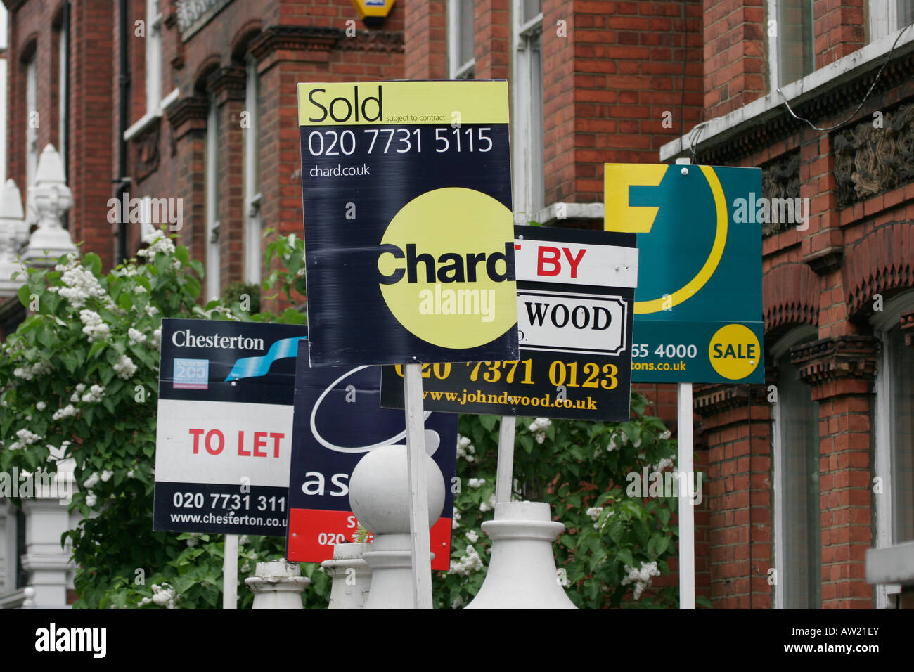 Property boards outside homes in Fulham London SW6 Stock Photo - Alamy