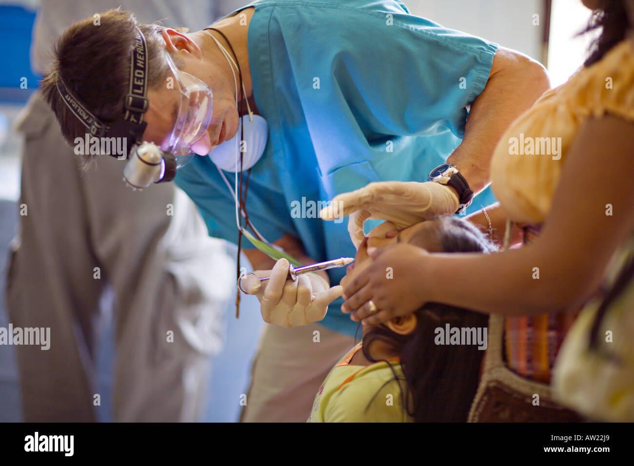 GUATEMALA SAN PEDRO LA LAGUNA Medical mission volunteer dentist injects ...