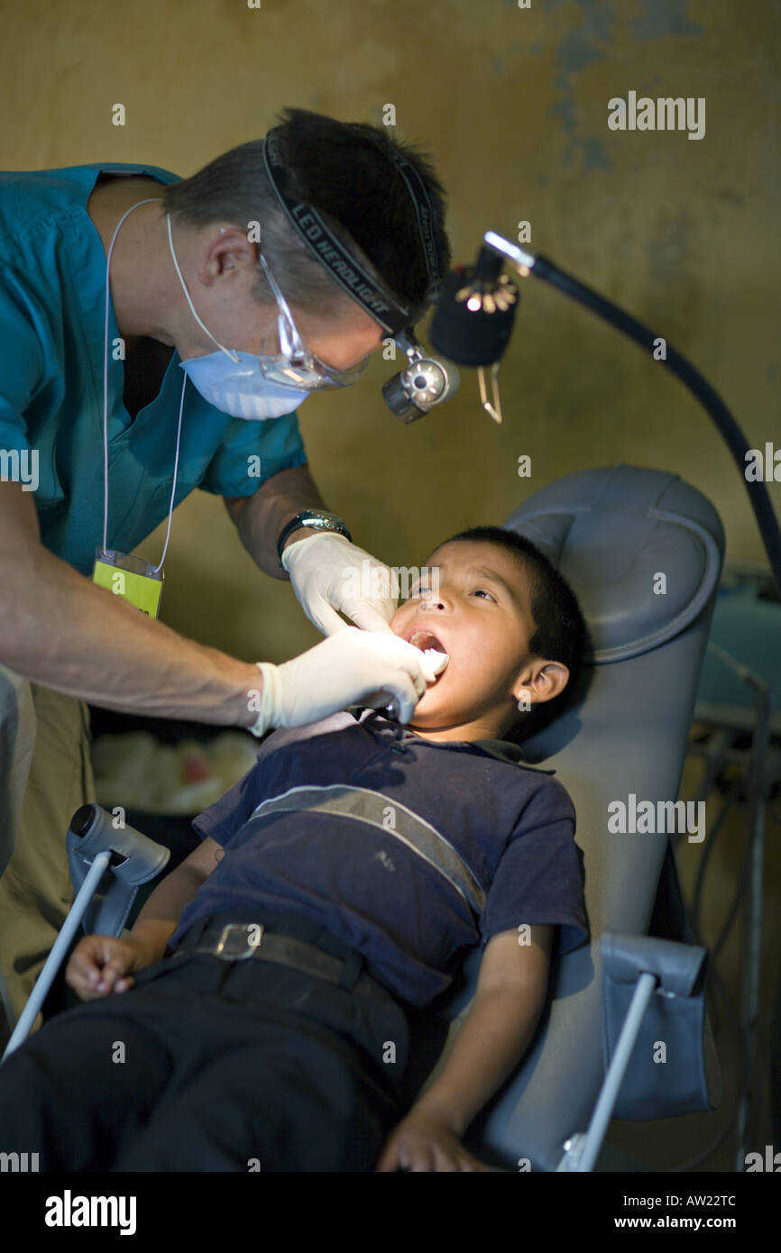 Dentist pulling tooth hi-res stock photography and images - Alamy