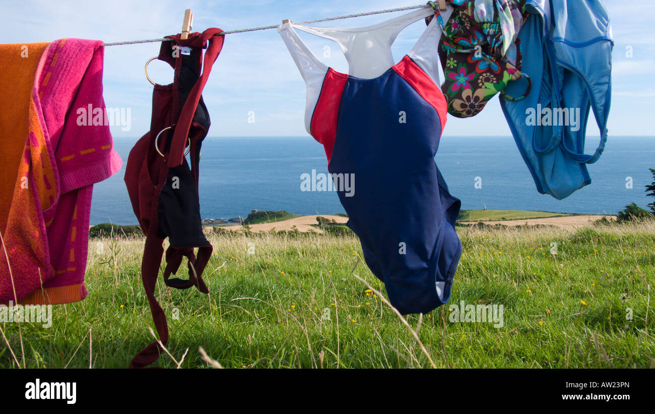 Swimming clothes drying on line at campsite Stock Photo - Alamy