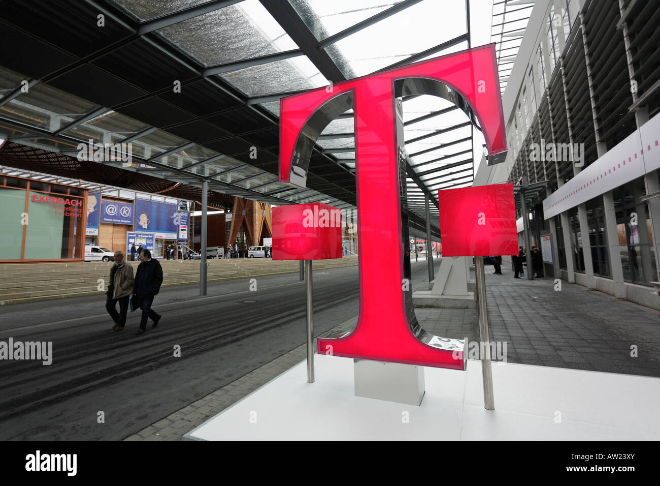 Germany Hanover 2008 - Fairgoers walk past logo of German ...