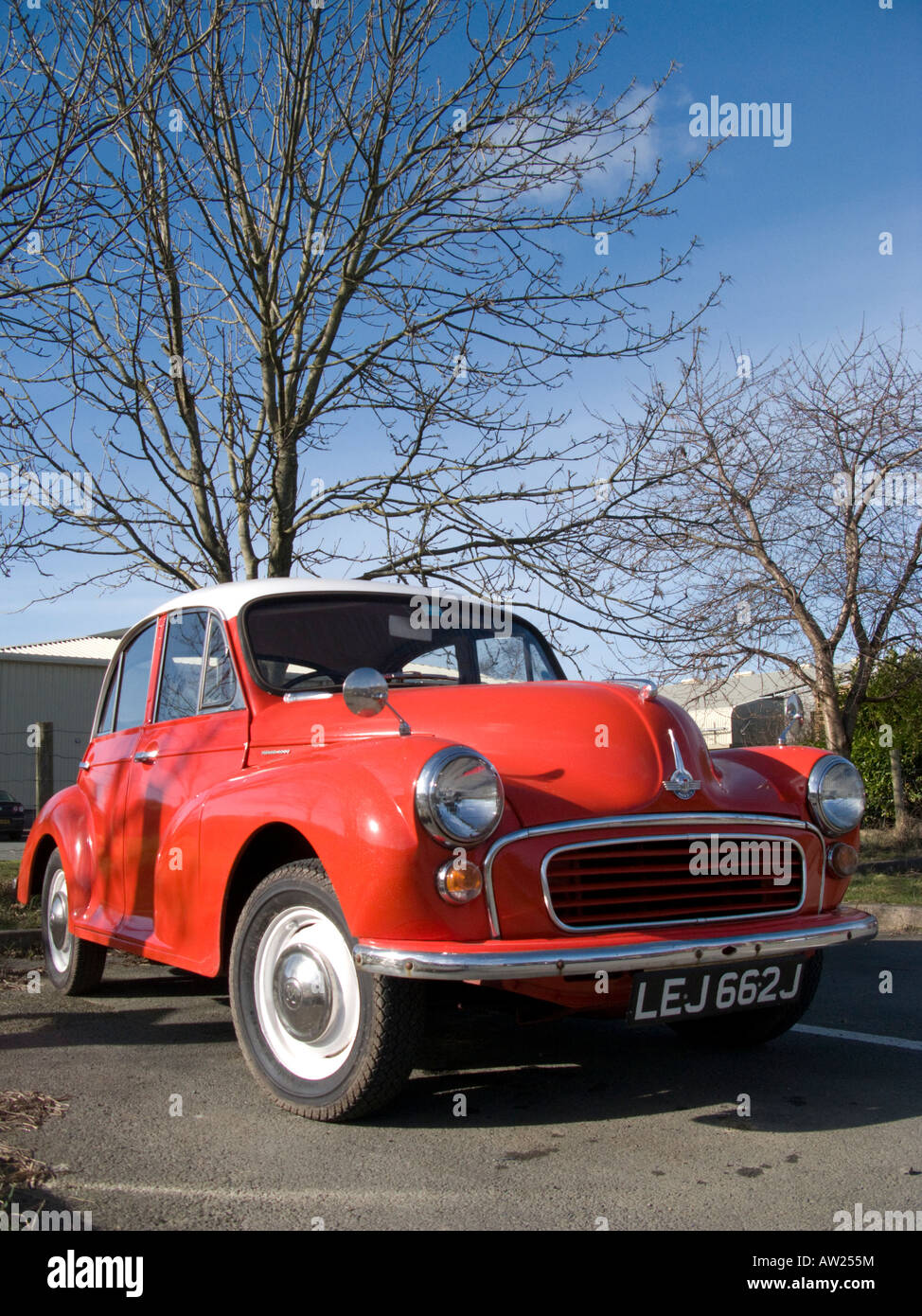 Old Morris Minor 1000 classic british motor car painted red on winter ...