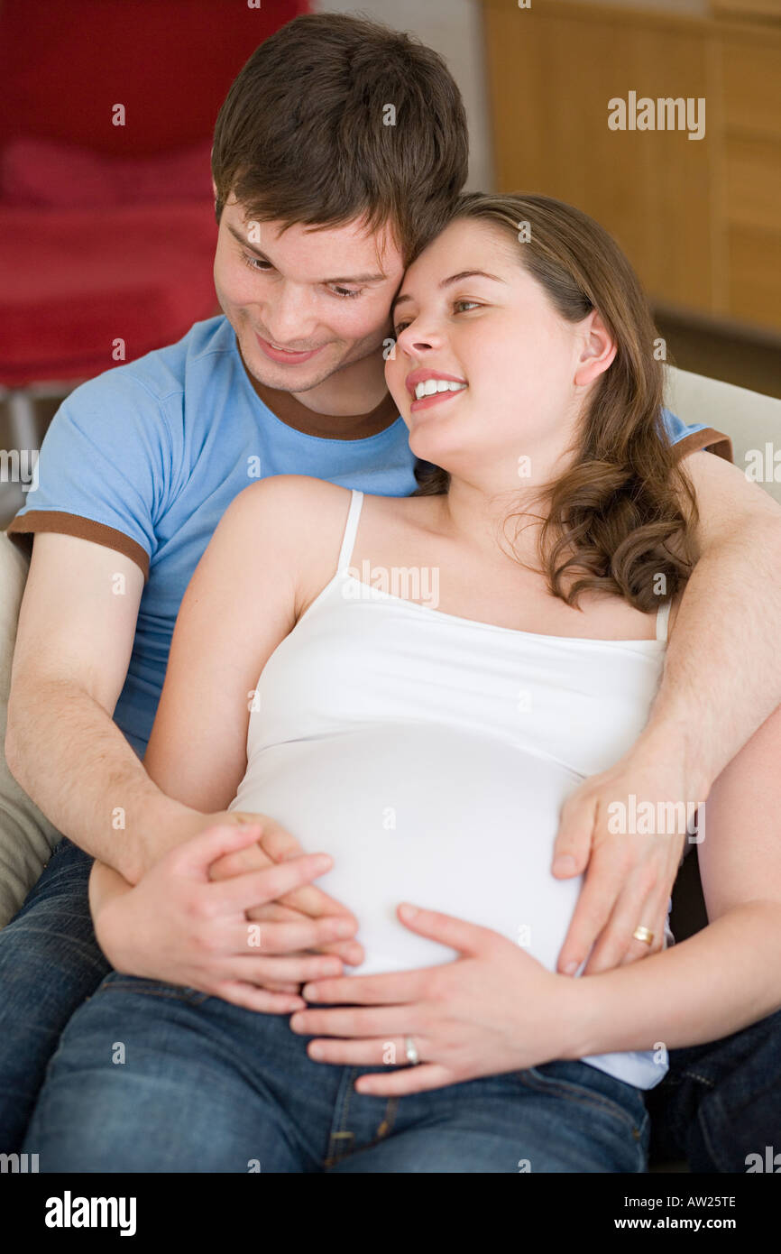 Pregnant woman hugging partner hi-res stock photography and images - Alamy