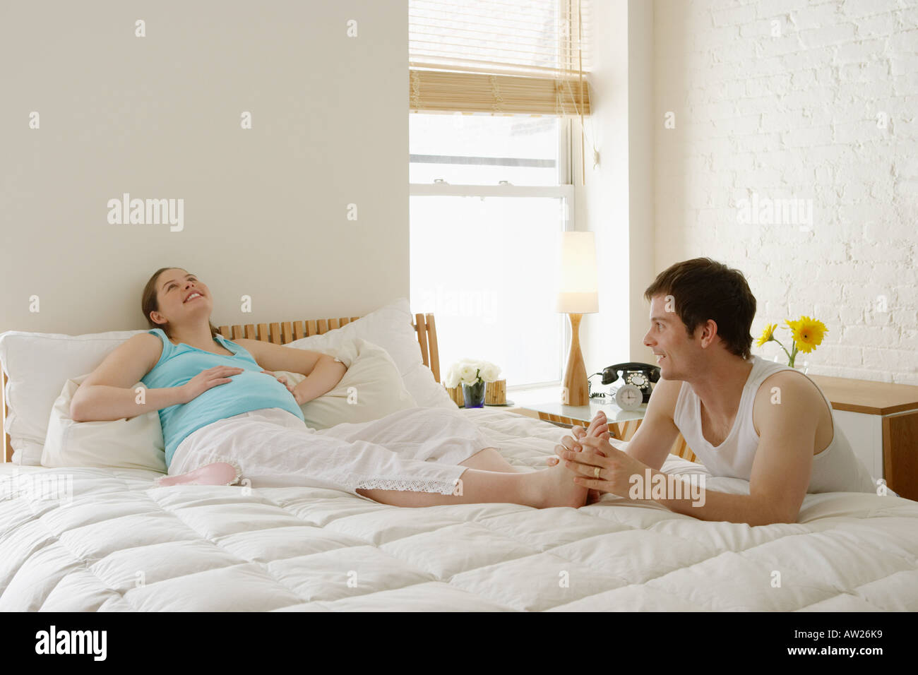 Man massaging pregnant partners foot hi-res stock photography and ...