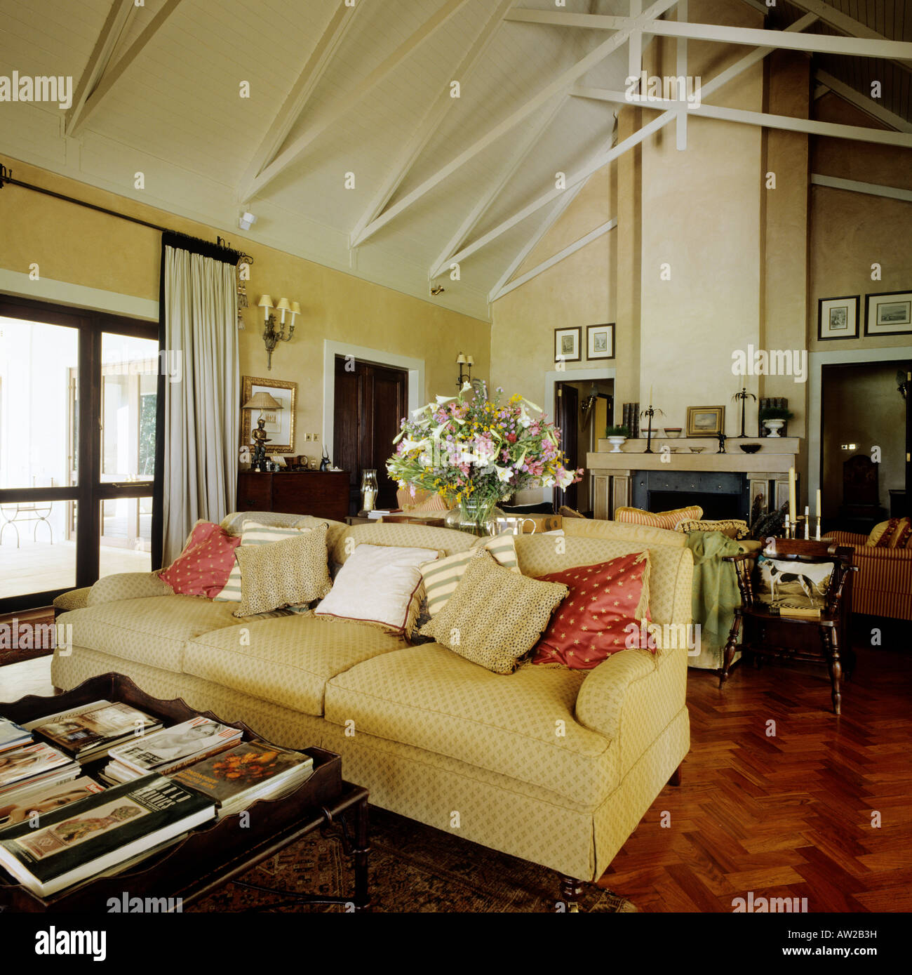living room in Zimbabwean farmhouse with pitched ceiling Stock Photo ...