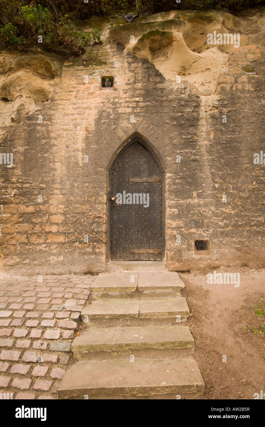 Medieval doorway carved into rockface at Castle rock Stock Photo - Alamy