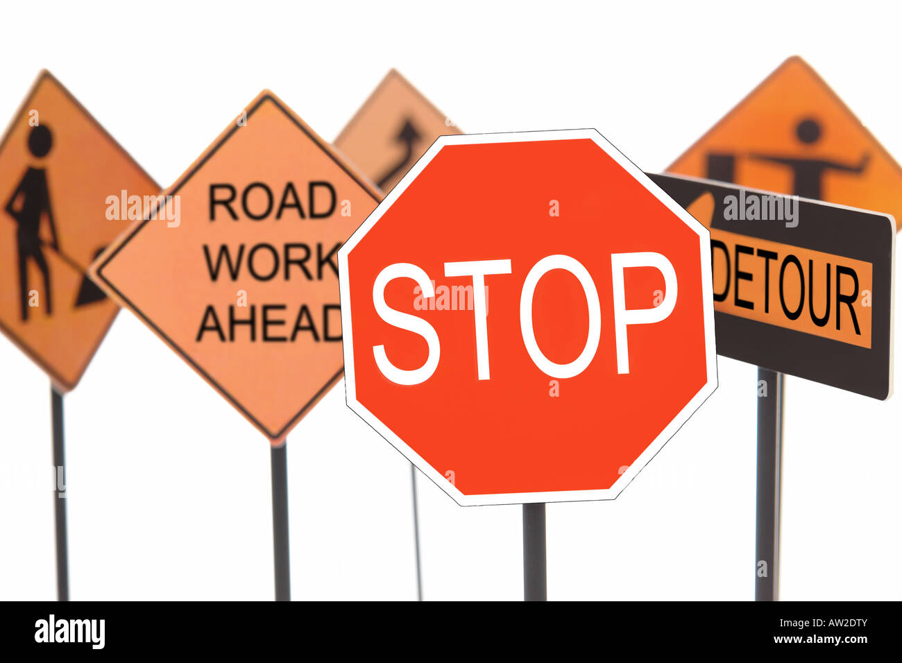 Closeup of stop sign with various american road construction signs in ...
