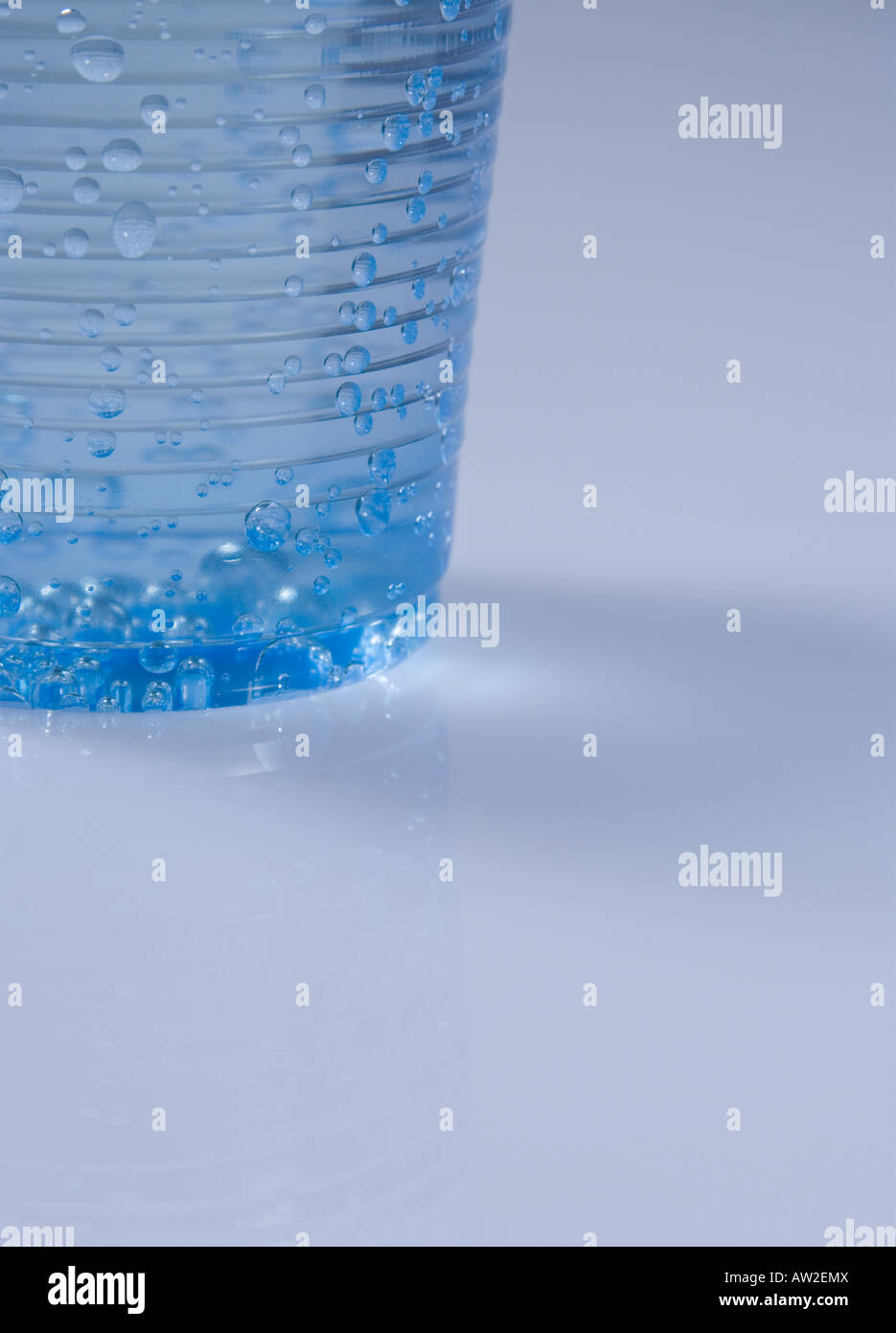 sparkling water bubbles in plastic cup Stock Photo - Alamy