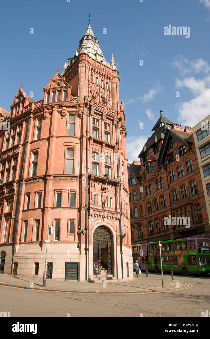 Victorian red brick building with relief carvings in centre of ...