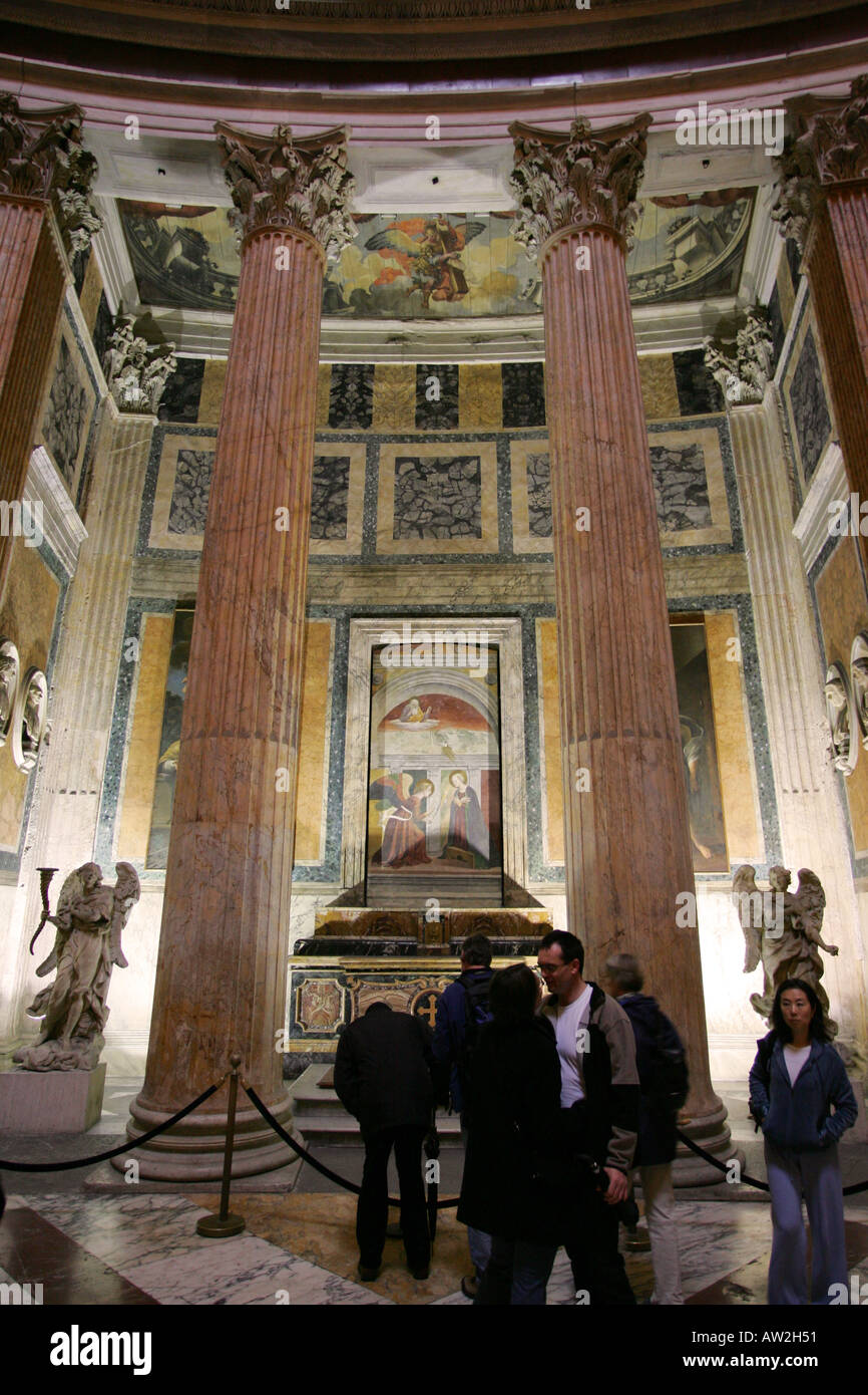 Tourists admire the corinthian columns and the Italian fresco paintings ...