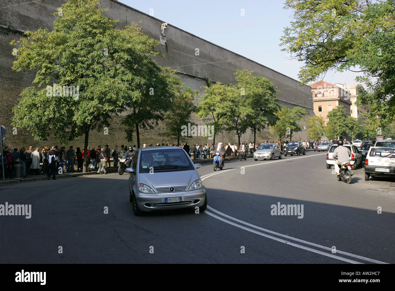 Very long queue line of tourists wait to enter the Vatican City Museums ...