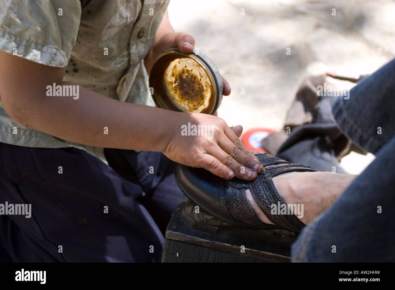 Mexican boy working hard to polish shoes in Chiapas Mexico Stock Photo ...