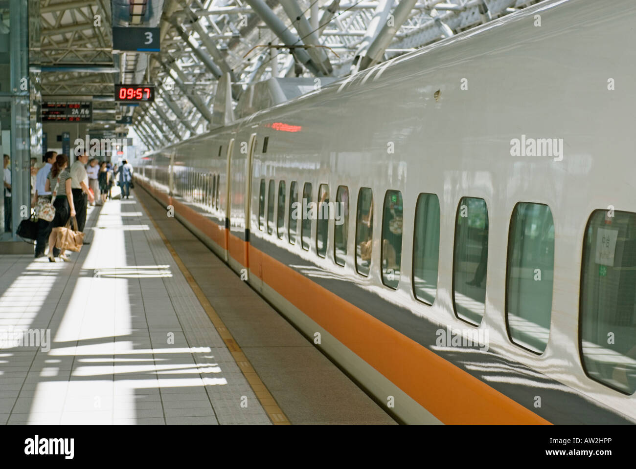 Passengers Waiting To Board High Speed Bullet Train On Station Platform ...
