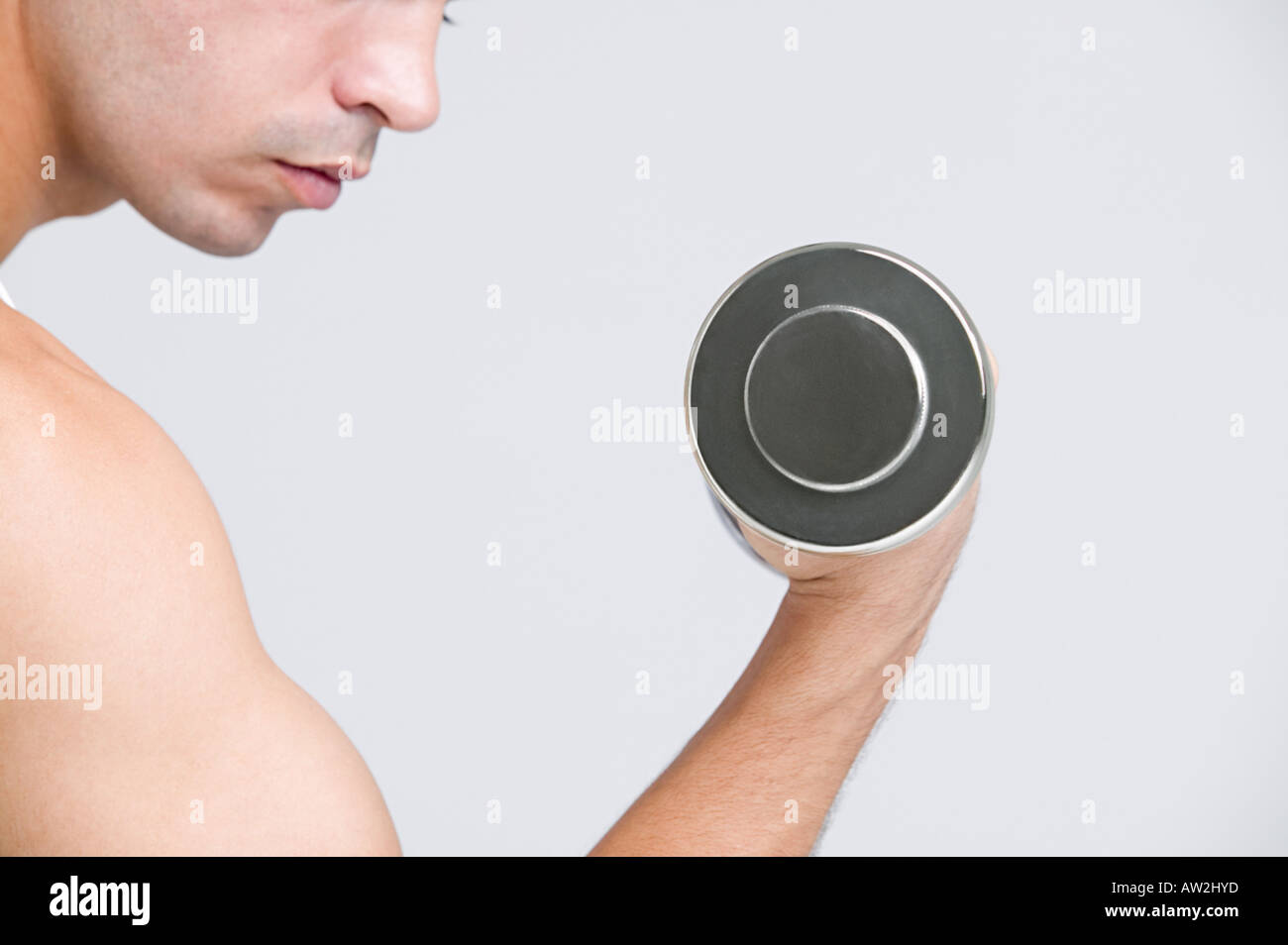 Man using dumbbell Stock Photo - Alamy