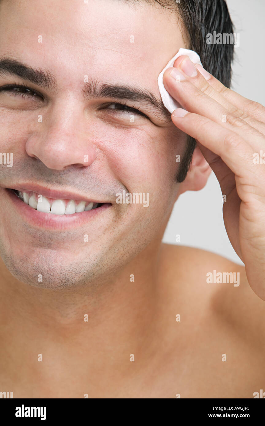 Man cleaning his face Stock Photo - Alamy