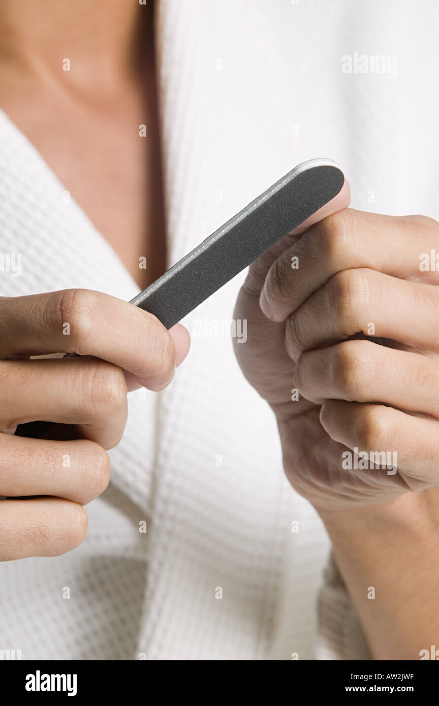Man filing his nails hi-res stock photography and images - Alamy