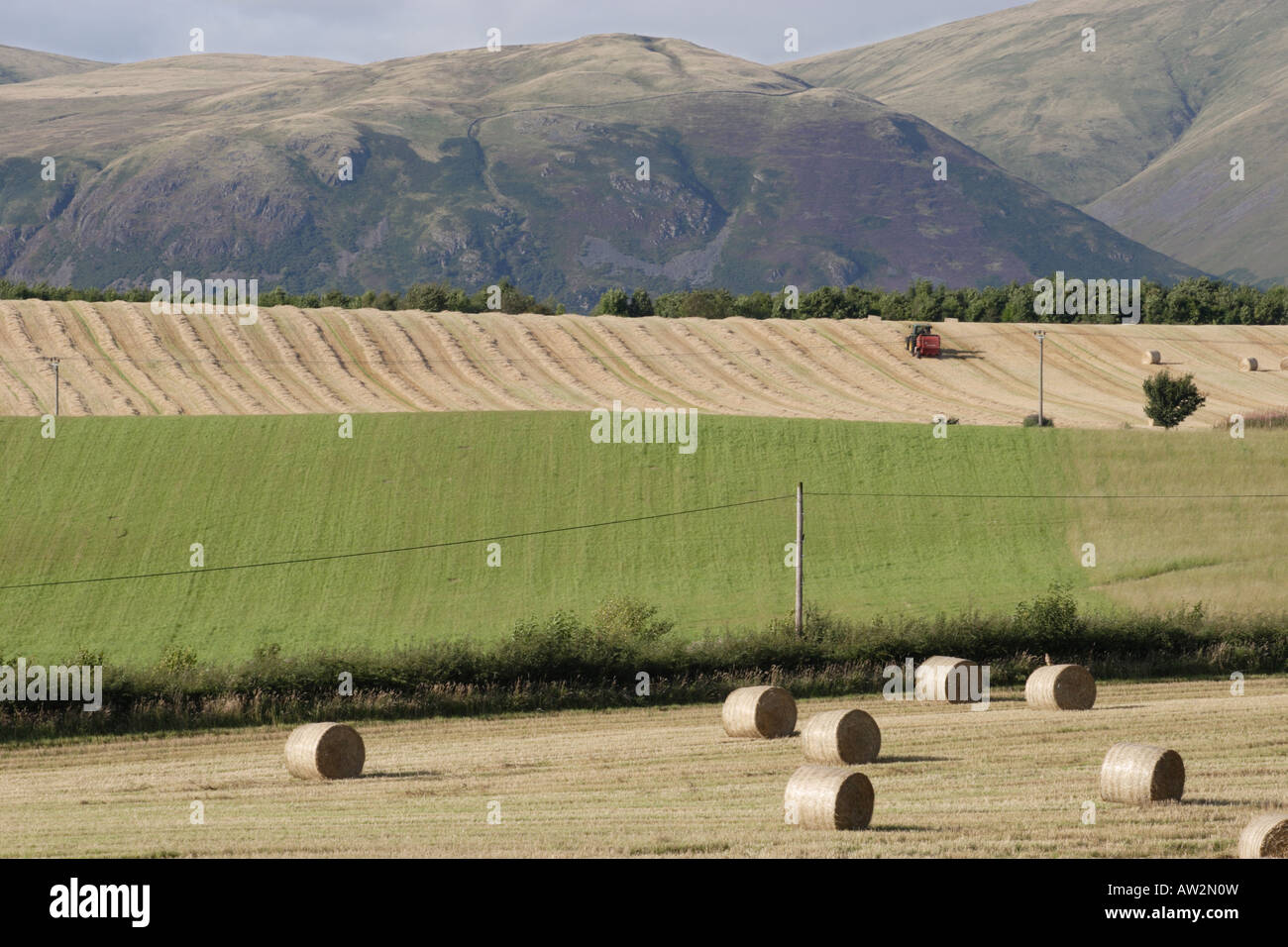 Harvesting tractor farm land scotland hi-res stock photography and ...