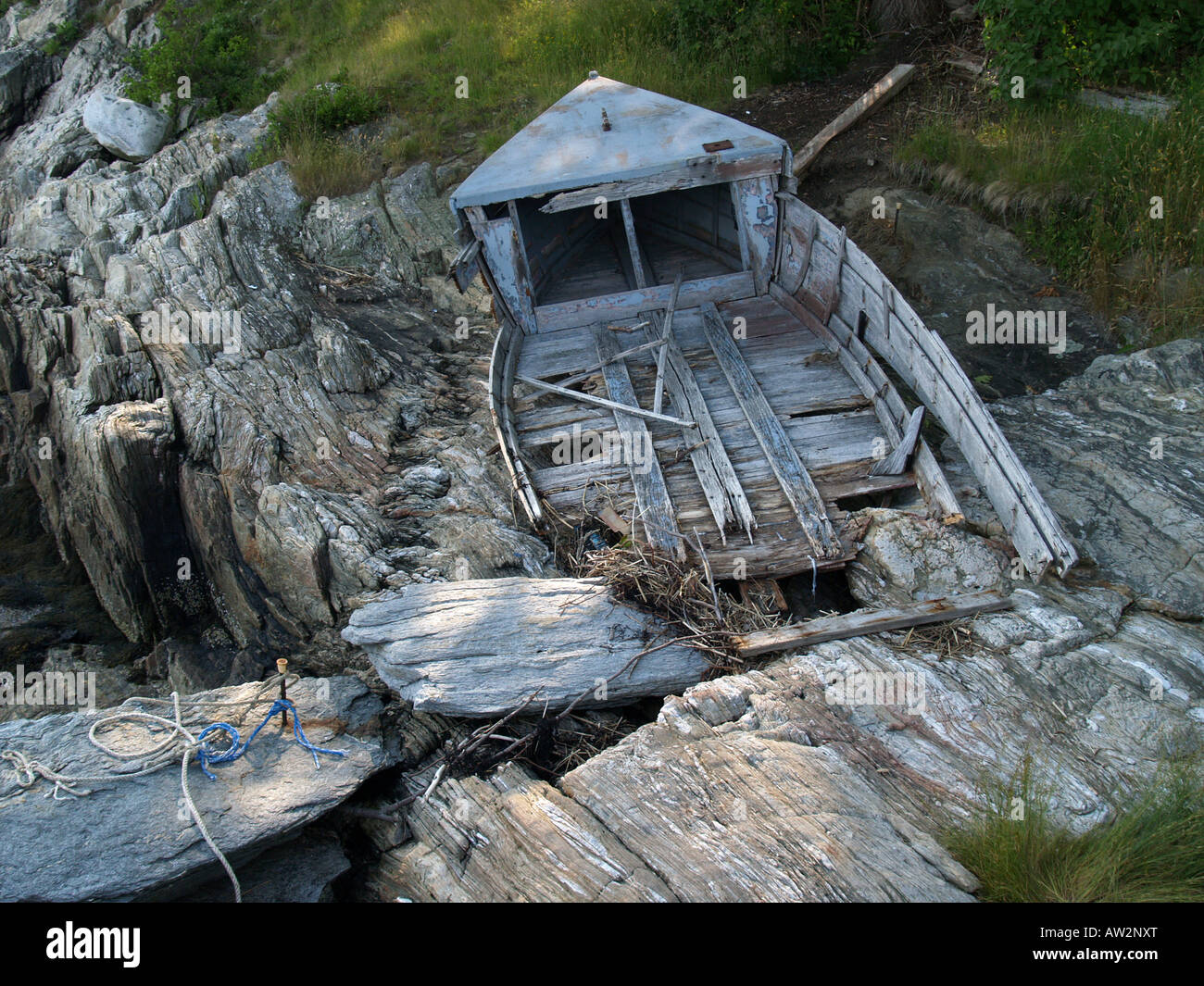 An abandoned rotting boat on a rocky Maine coastline Stock Photo - Alamy