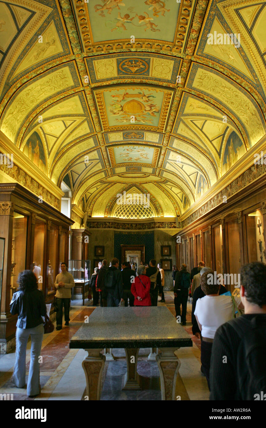 Tourists walk through beautiful bright decorated corridors with painted ...