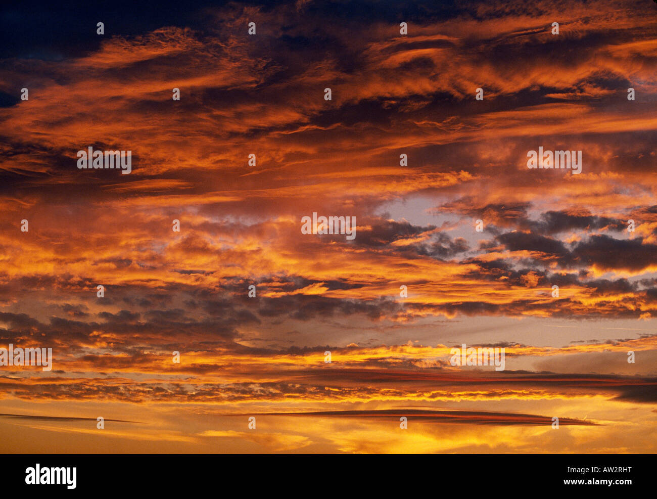 CLOUDS REFLECTING THE LIGHT OF THE SETTING SUN UK Stock Photo - Alamy