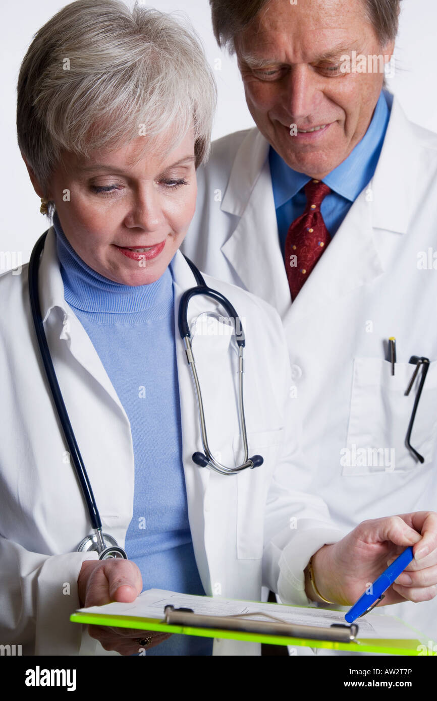 two senior medical doctors looking at chart Stock Photo - Alamy