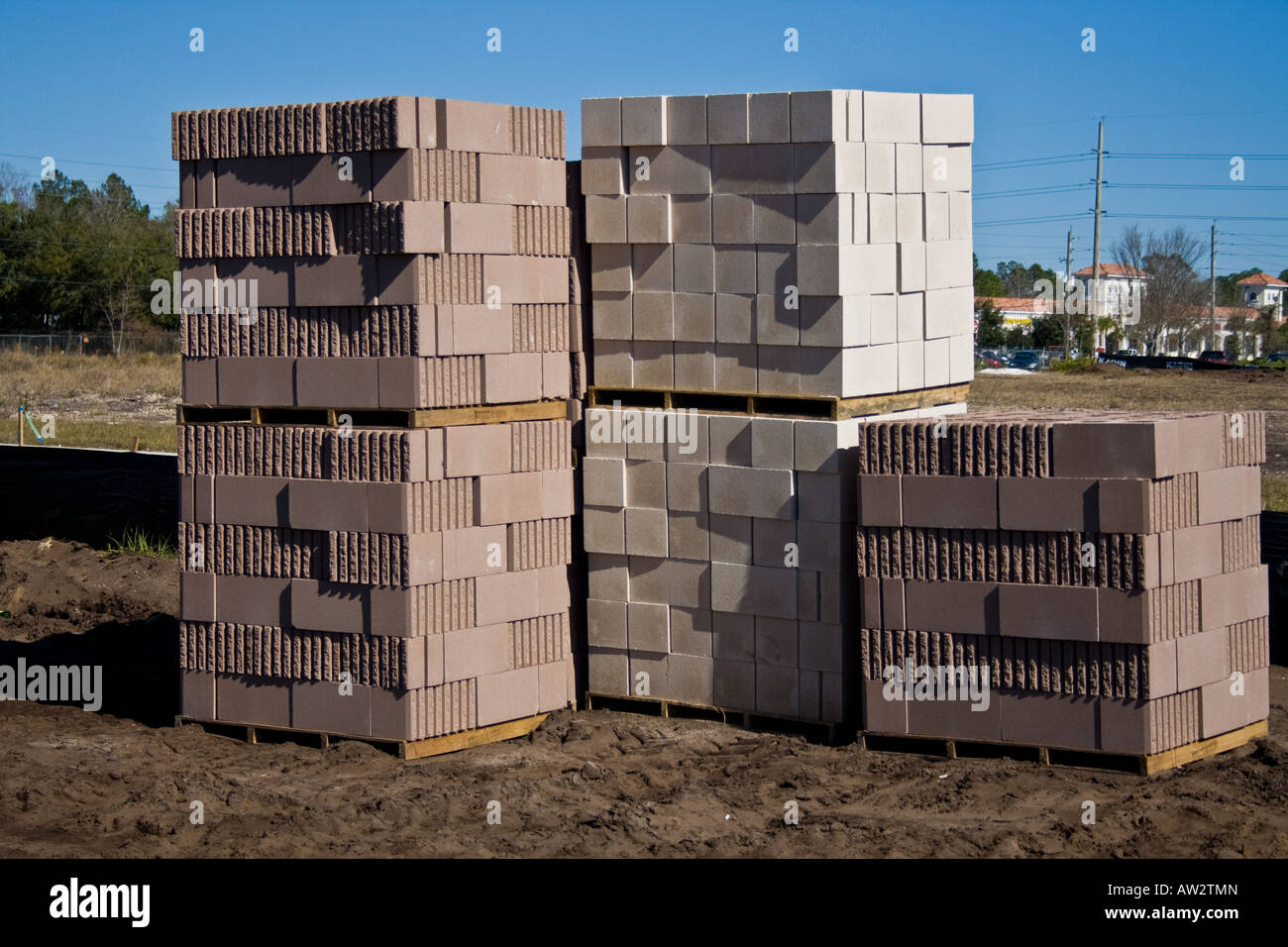 Group of 5 pallets of construction material at a construction site on ...