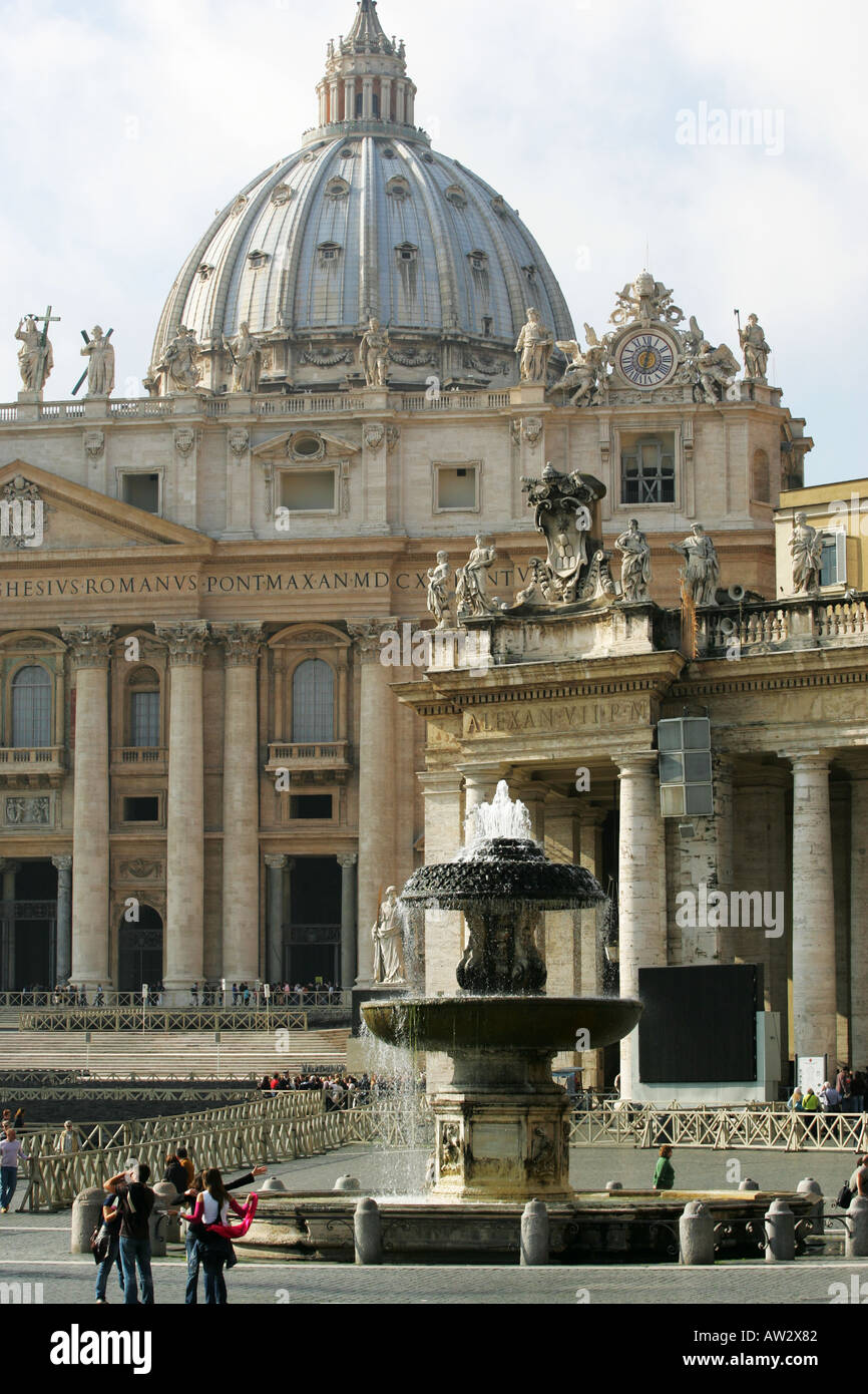 Ornate Renaissance water fountain in front of famous St Peters basilica ...