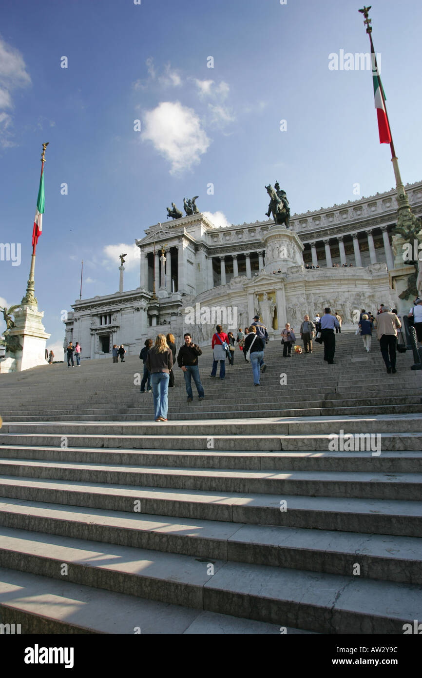 Tourists explore the giant white building and steps of the Piazza ...