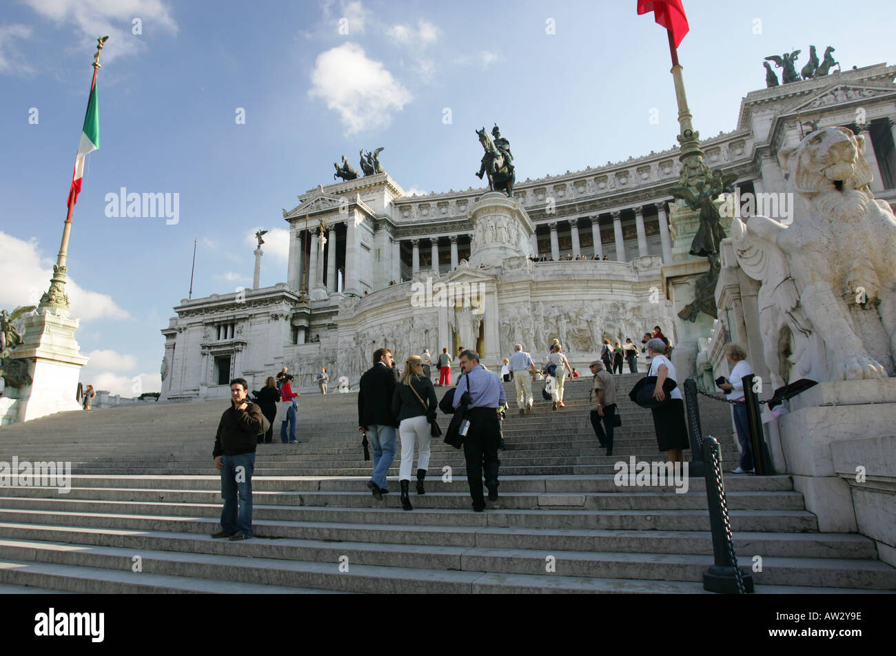 Tourists explore the giant white building and steps of the Piazza ...