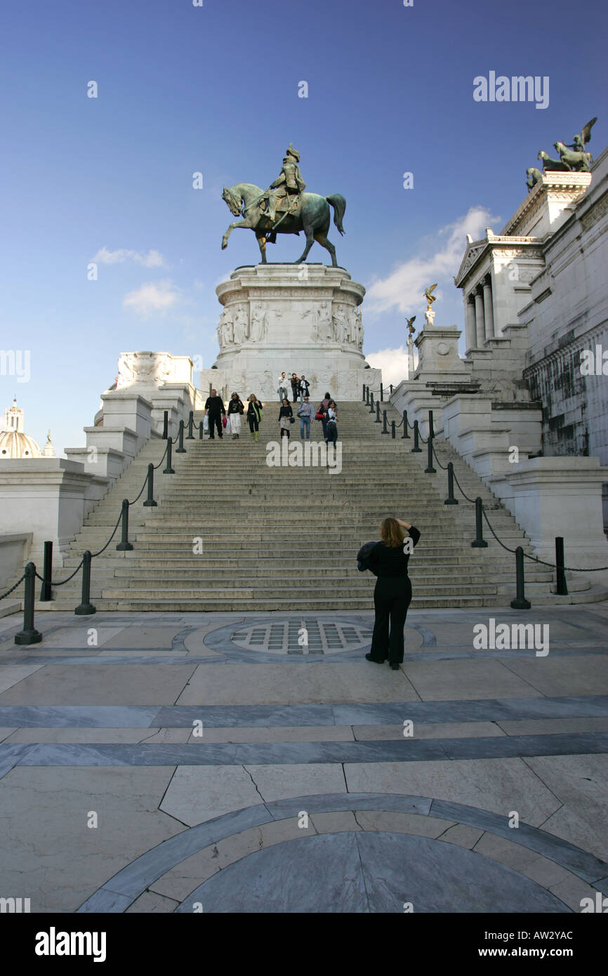 A tourist photographs a giant bronze statue at the famous Piazza ...