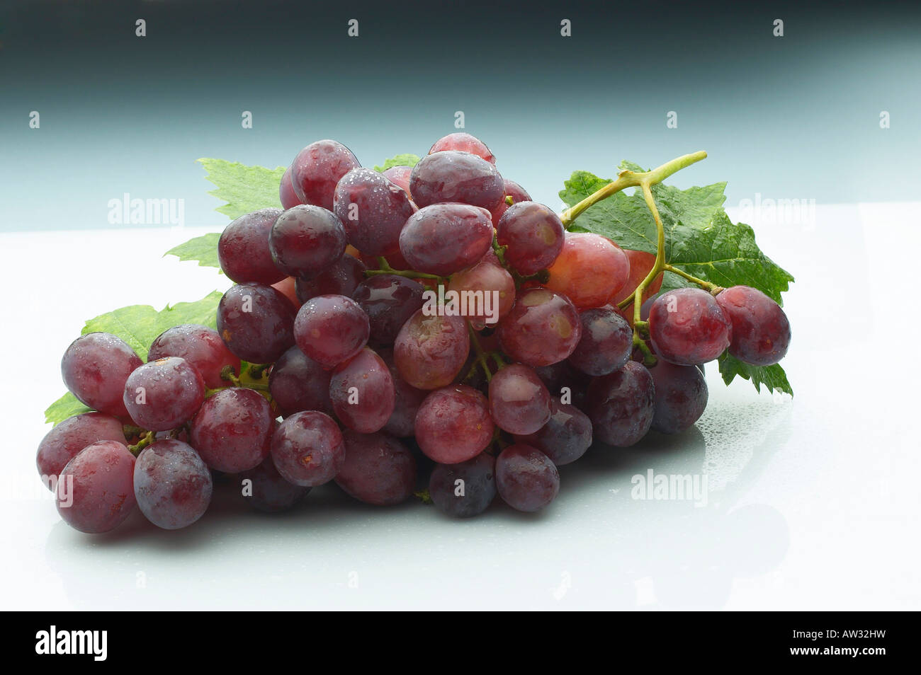 grapes with leaves Stock Photo - Alamy