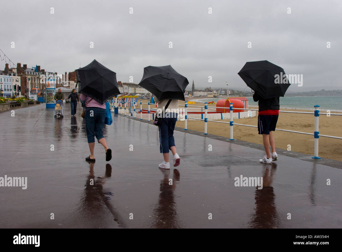 Weymouth beach and seafront promenade in the persistent Summer rain ...