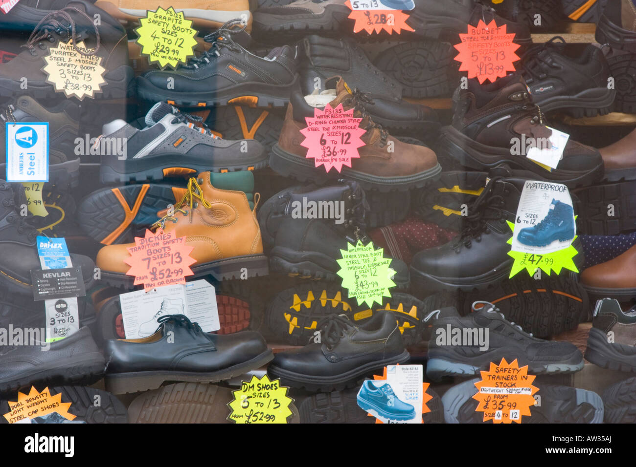 Boots shoes and trainers on display in the window of an outdoor ...