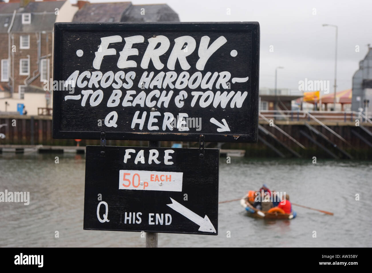 Ferryman rowing passengers across the harbour in Weymouth Dorset Stock ...