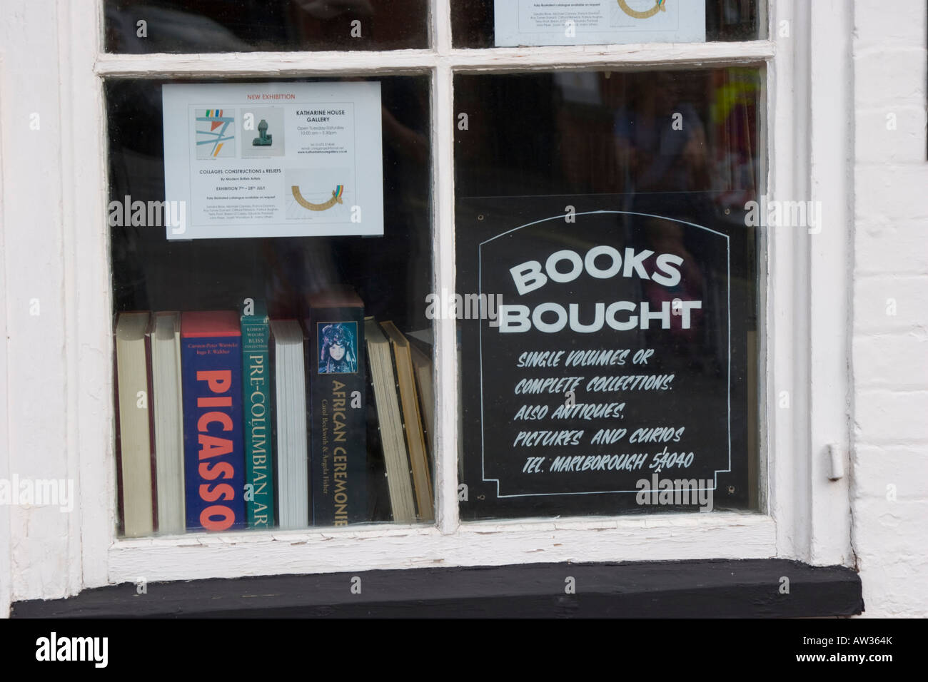 Notice in a secondhand bookshop window Books bought Stock Photo - Alamy