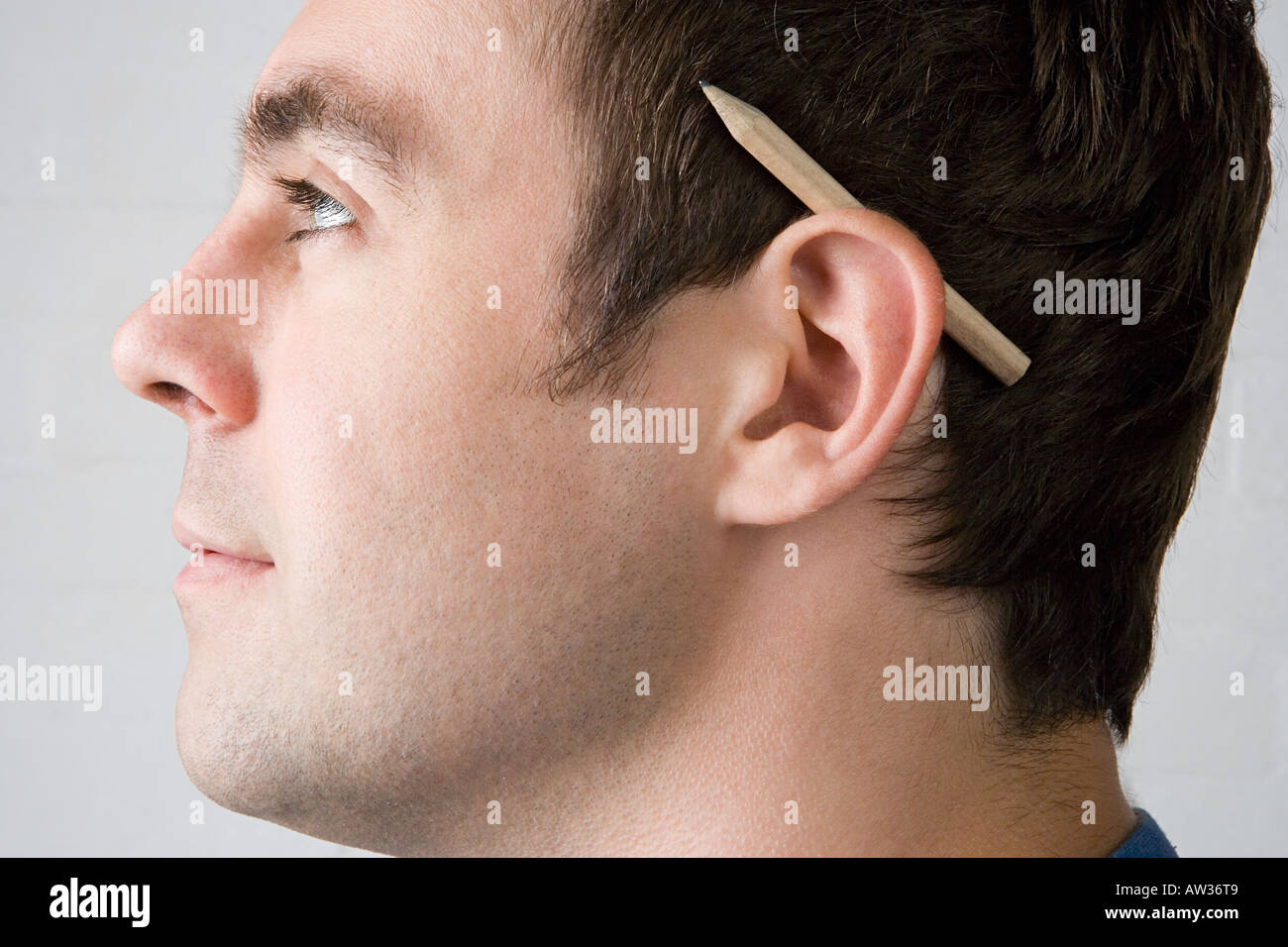 Man with a pencil behind his ear hi-res stock photography and images ...