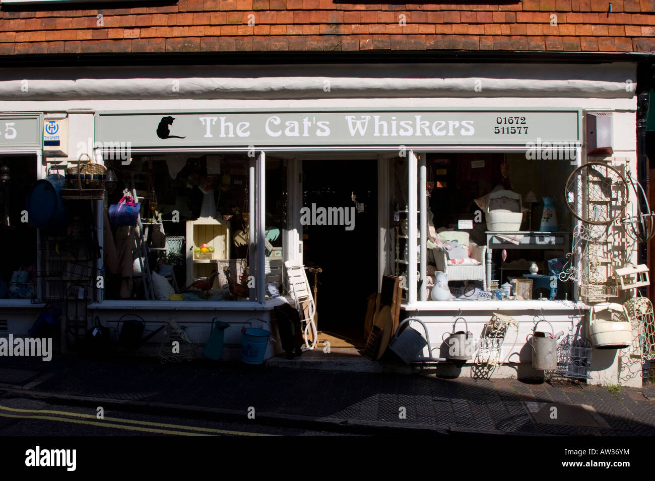 Antiques shop window Stock Photo - Alamy