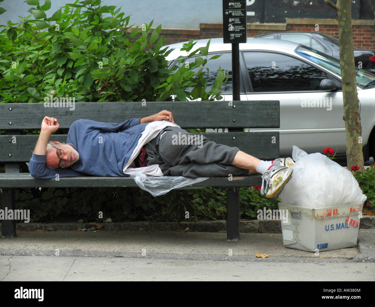 Homeless Person Sleeping On Bench