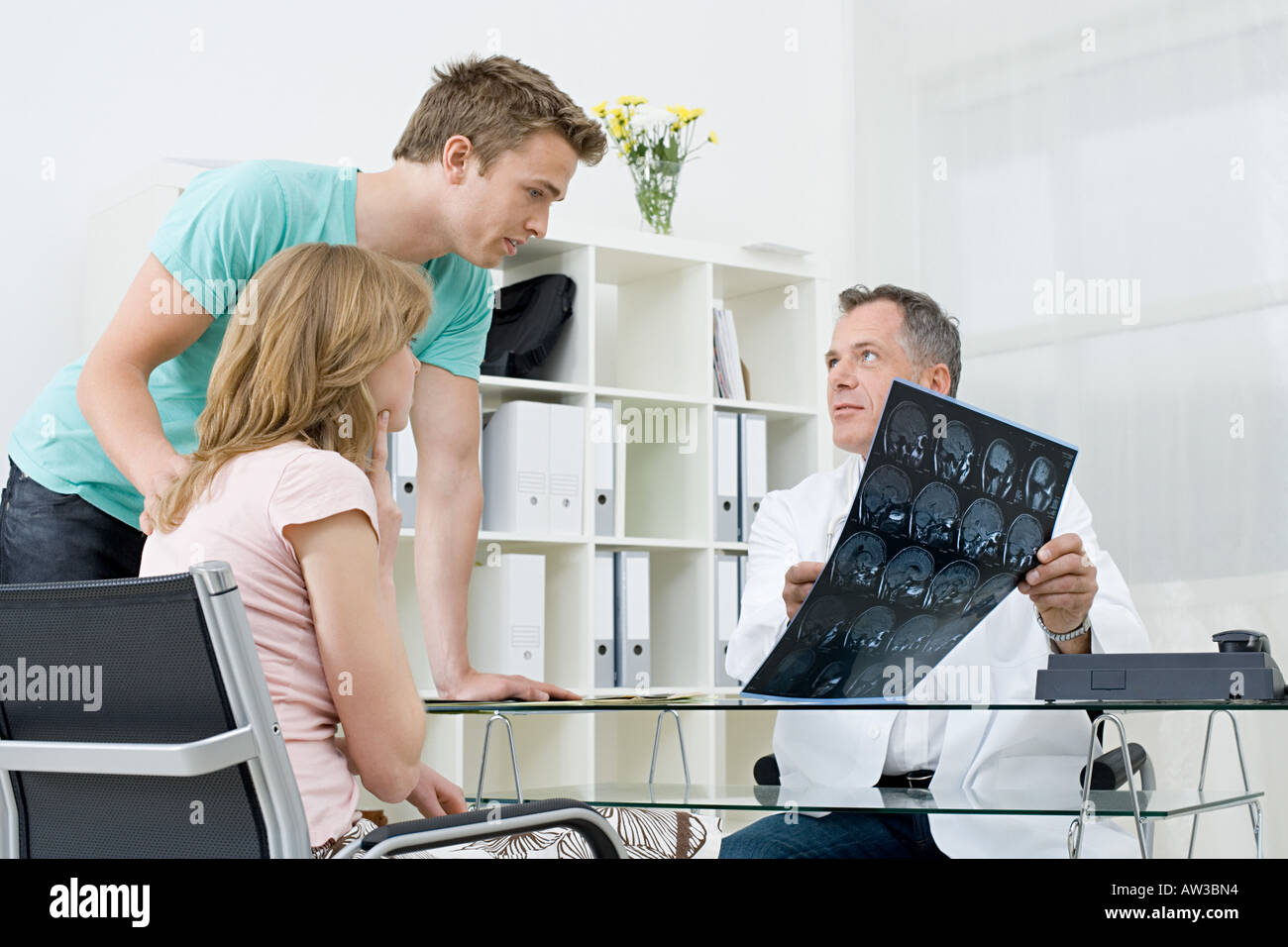 Patient with doctor and boyfriend Stock Photo - Alamy
