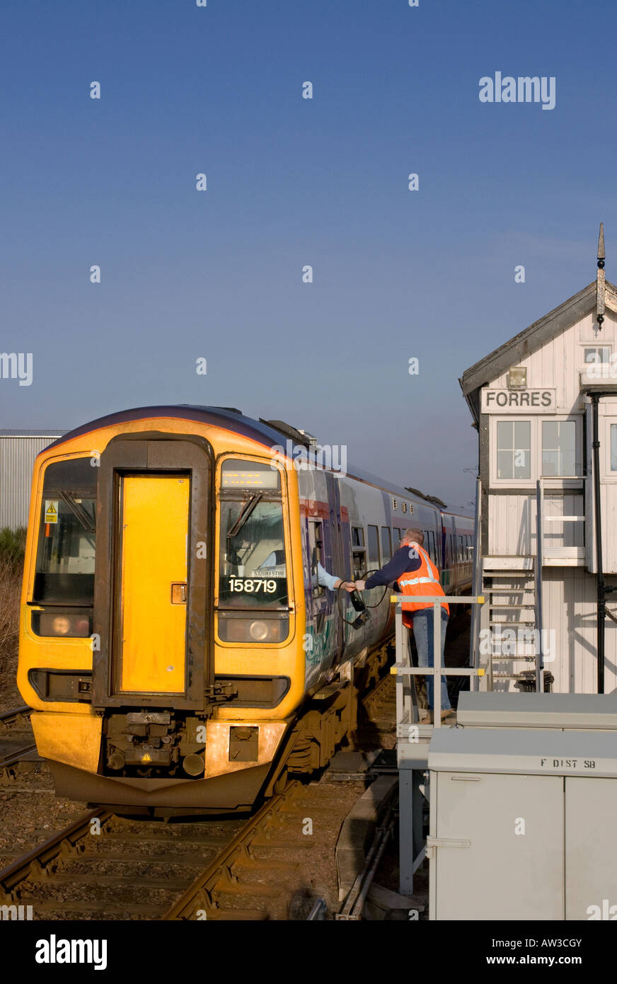 class 158 diesel multiple unit no 158719 exchanging single line tokens ...