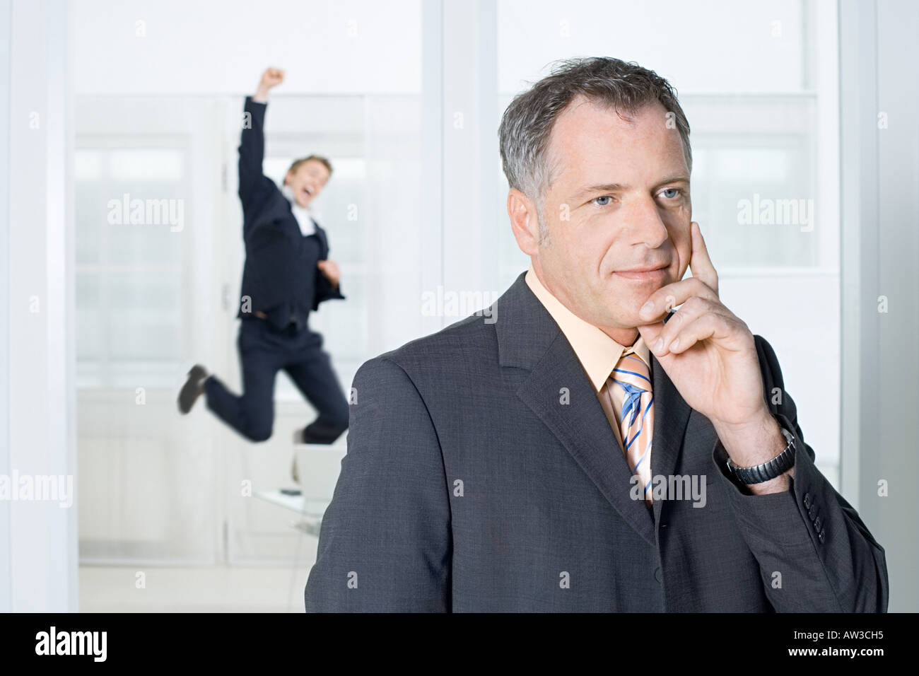Businessmen thinking and jumping Stock Photo - Alamy