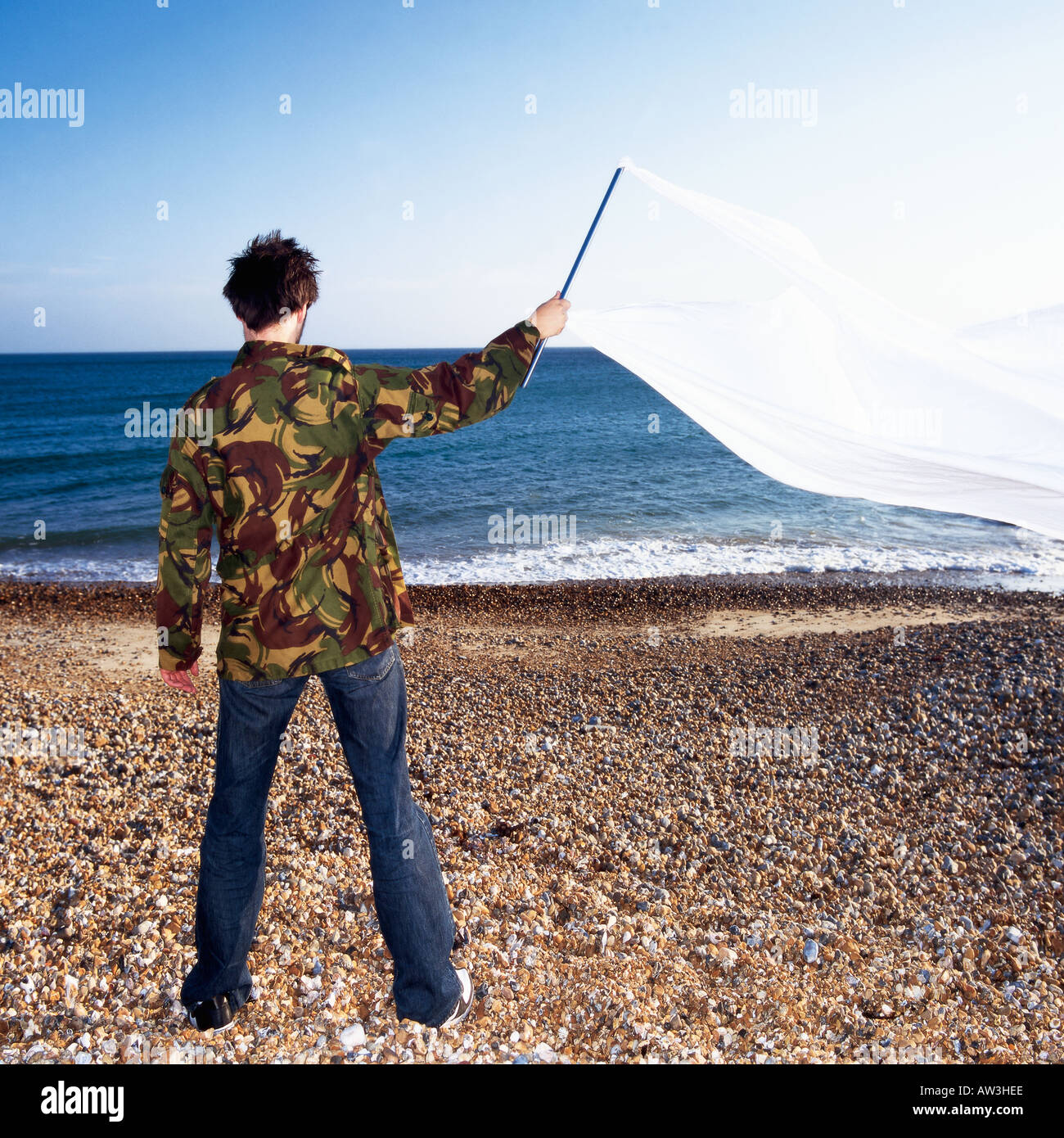Man surrendering on beach Stock Photo - Alamy