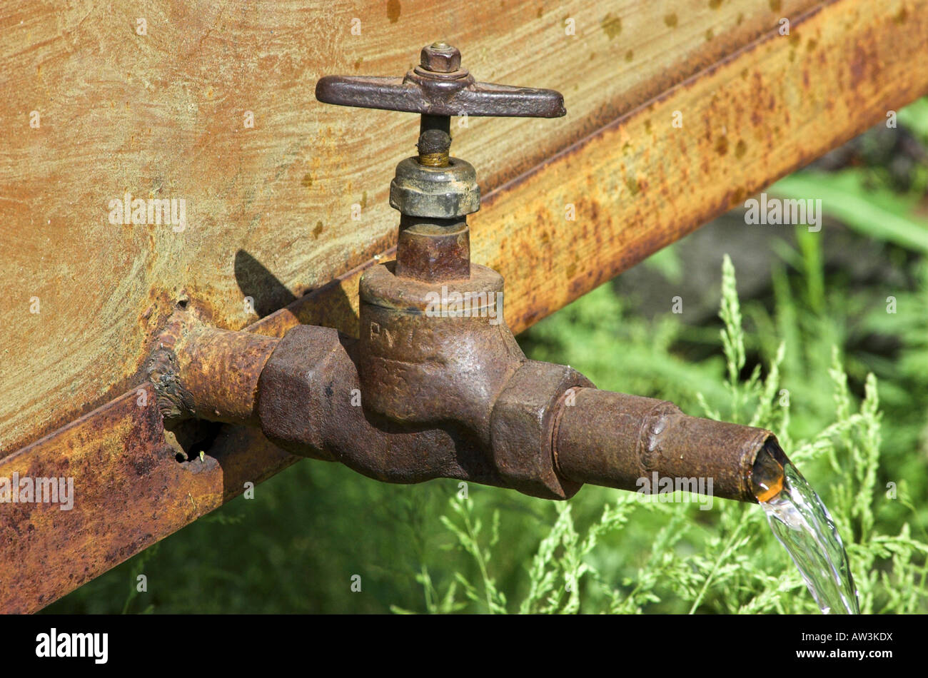 Old tap with water flow Stock Photo - Alamy