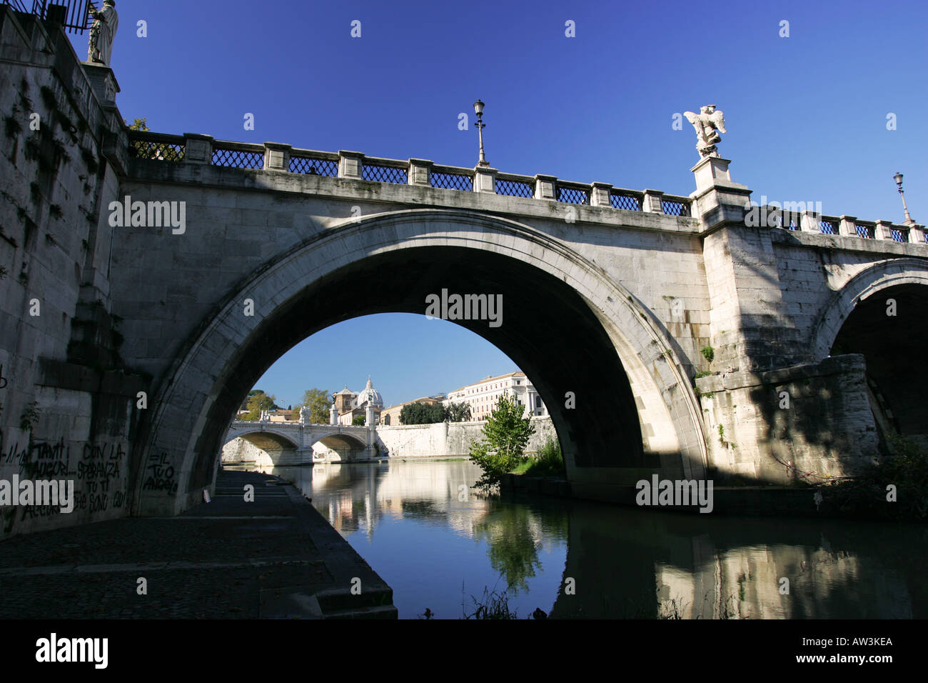The Vatican City viewed through an arch of famous Rome bridge the Ponte ...