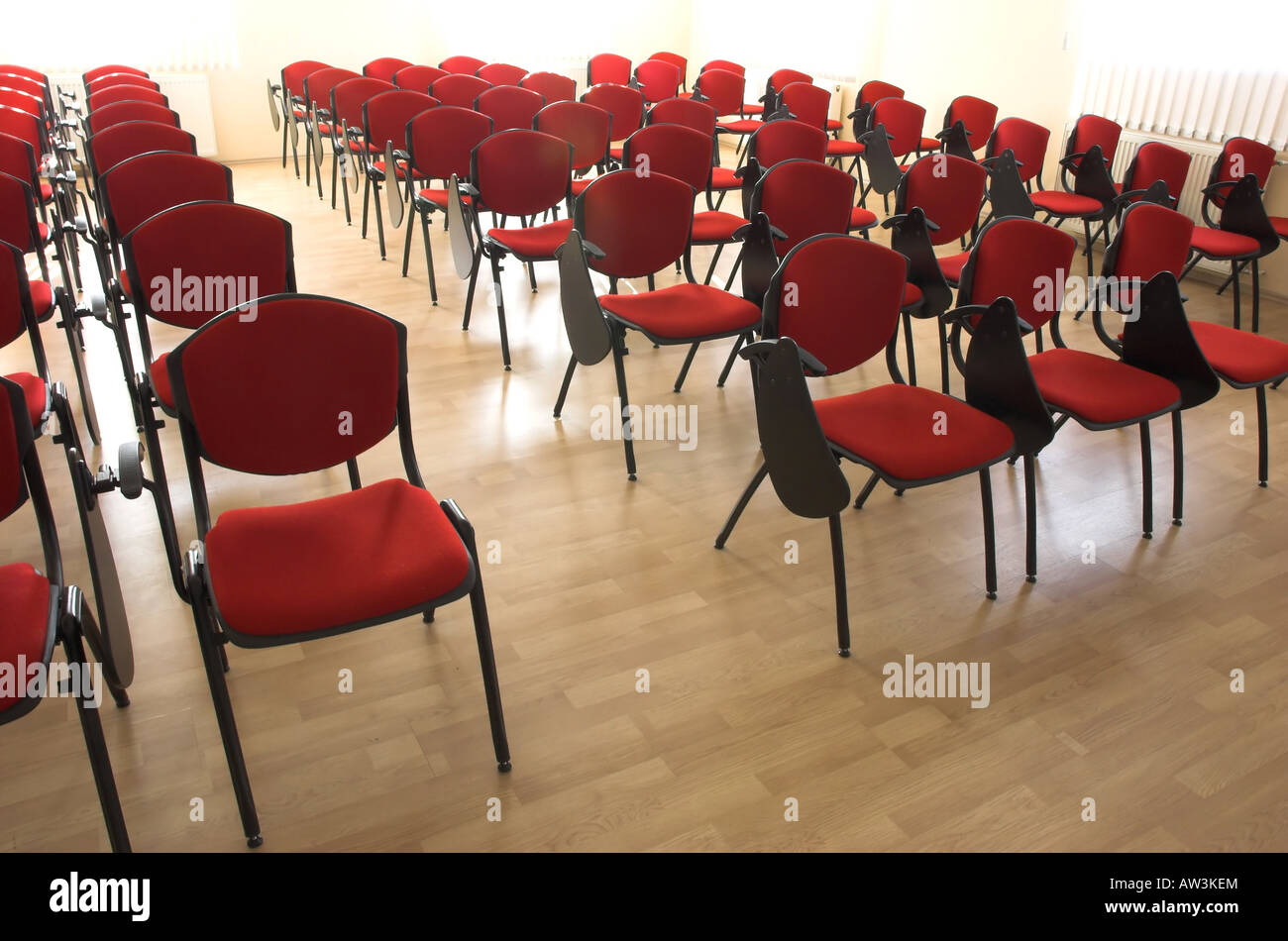 red chairs rows in conference hall Stock Photo - Alamy