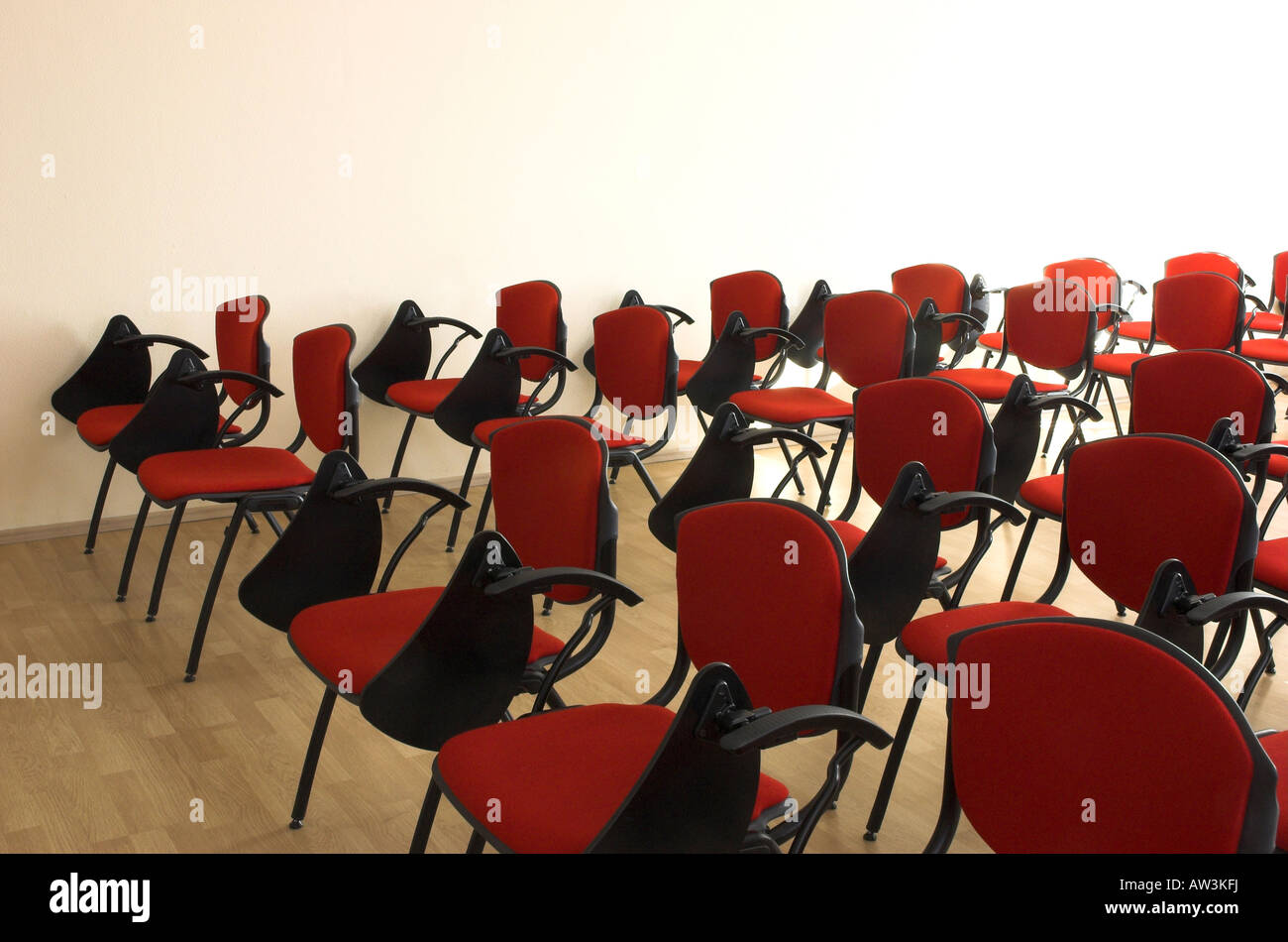 red chairs rows in conference hall Stock Photo - Alamy