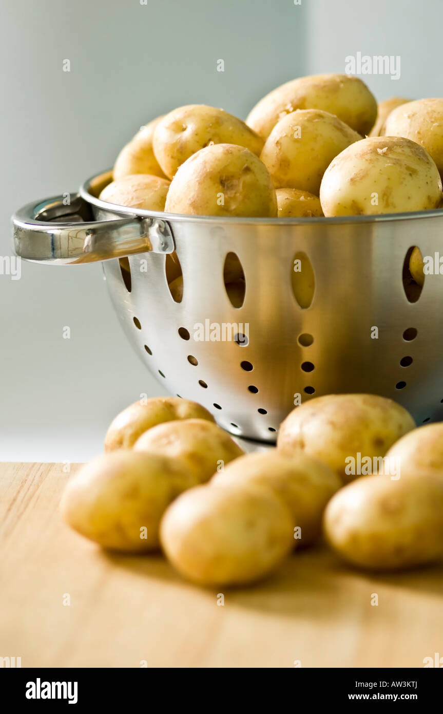 New potatoes in colander food close-up Stock Photo - Alamy