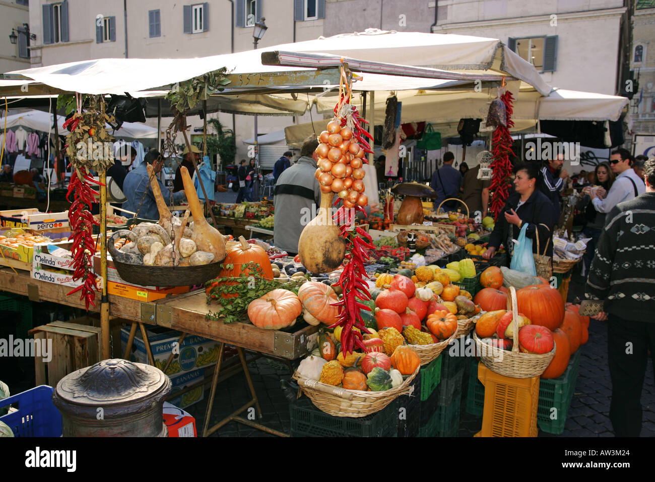 Local people buy fresh fruit and vegetables from this typical Italian ...